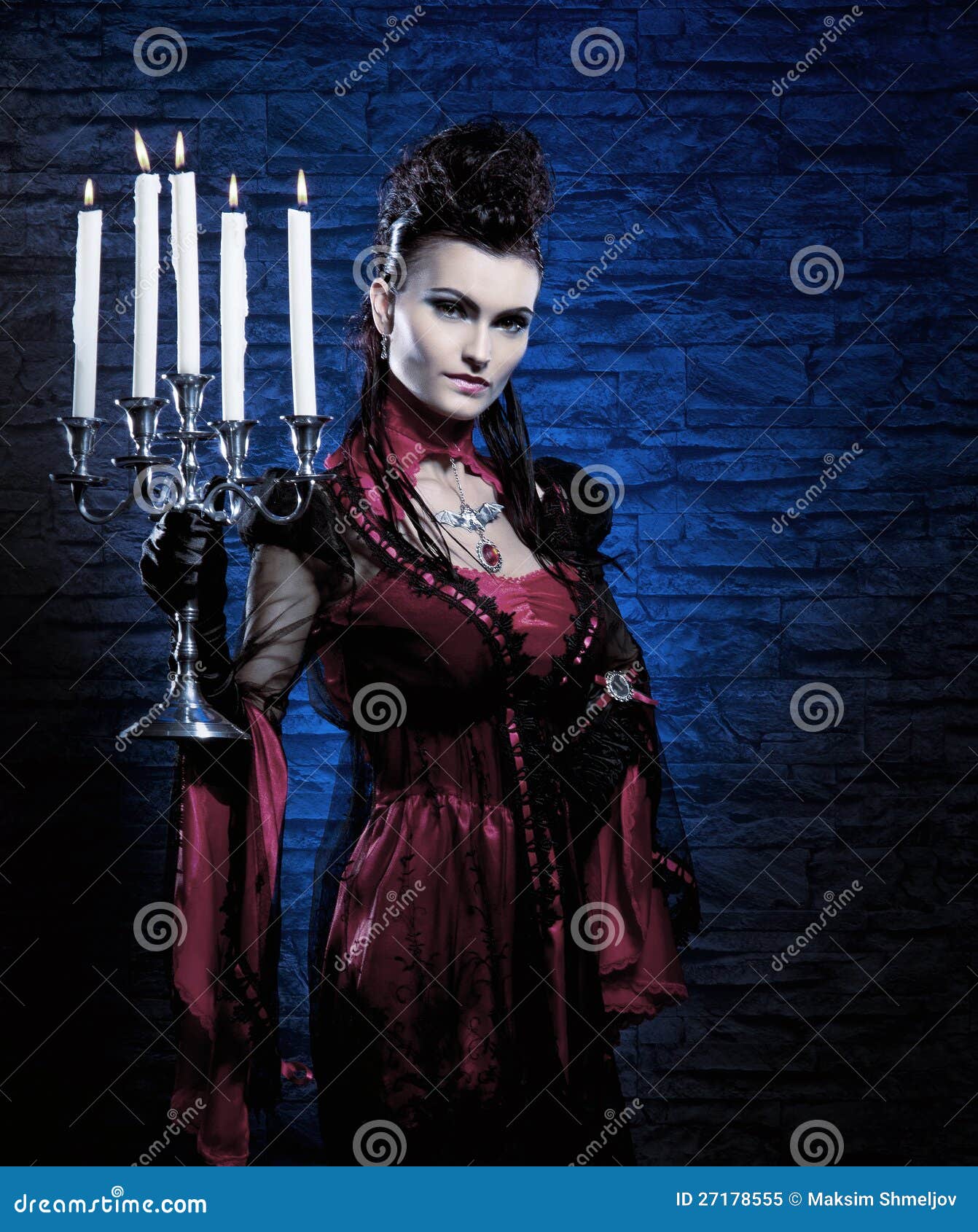 A Young and Lady Vampire Holding Candles Stock Image - Image of fire ...
