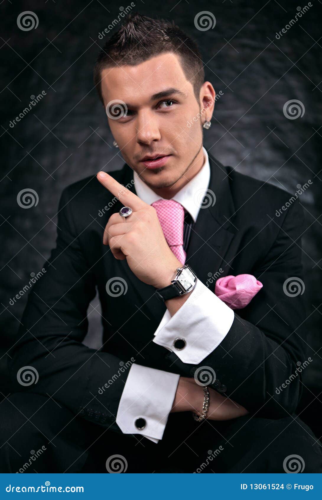 Young macho in a suit stock photo. Image of male, serious - 13061524