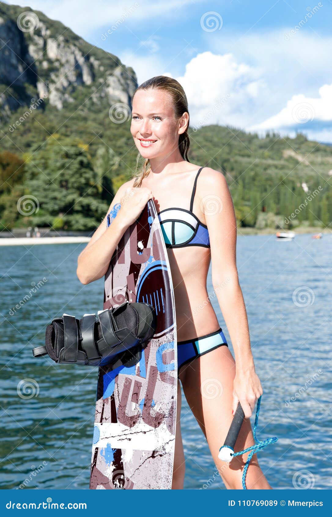 Woman Is Wakeboarding Surfing In The Water At The Beach Stock Image