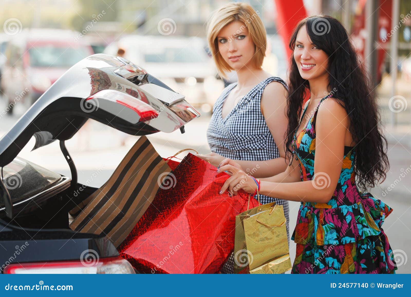 Young Shoppers on a Car Parking Stock Photo - Image of buyer, friends ...