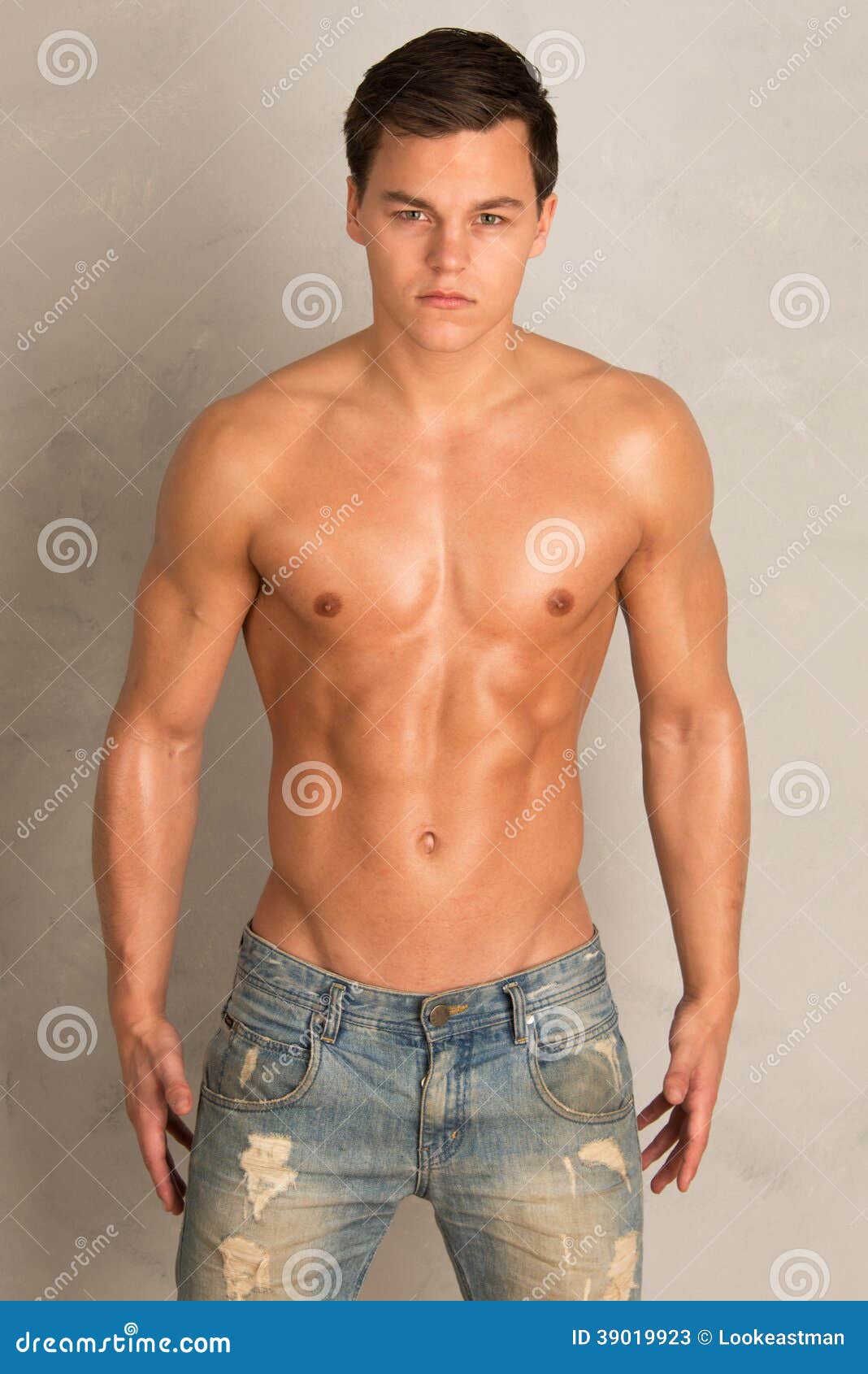 Young Shredded Man in Front of a Wall Stock Image - Image of isolated ...