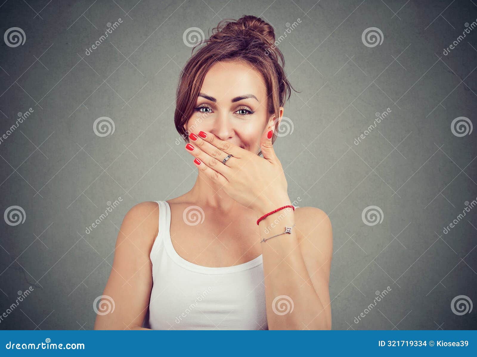 Young Shy Woman Smiling and Playfully Looking at Camera Stock Photo ...