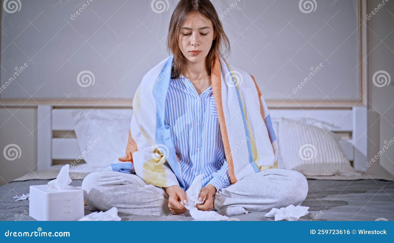 Young Sick Female with a Cold Sitting on a Bed with a Blanket ...