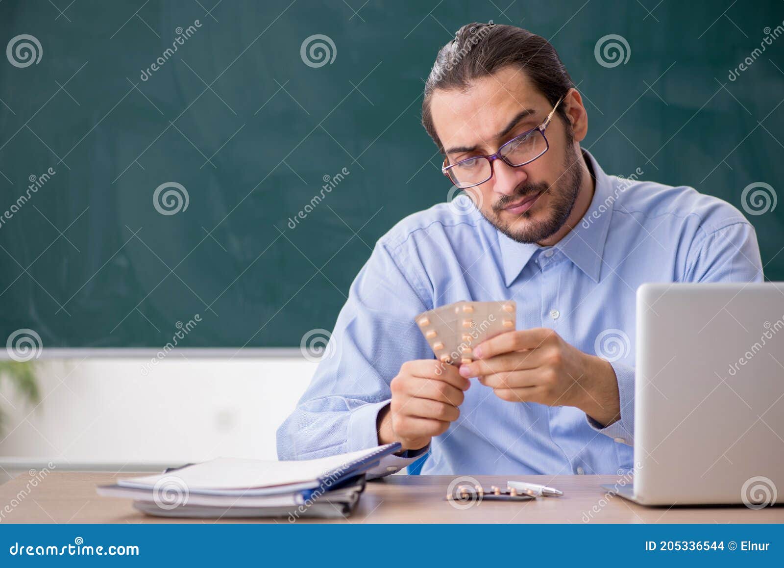 Young Sick Male Teacher in the Classroom Stock Photo - Image of ...
