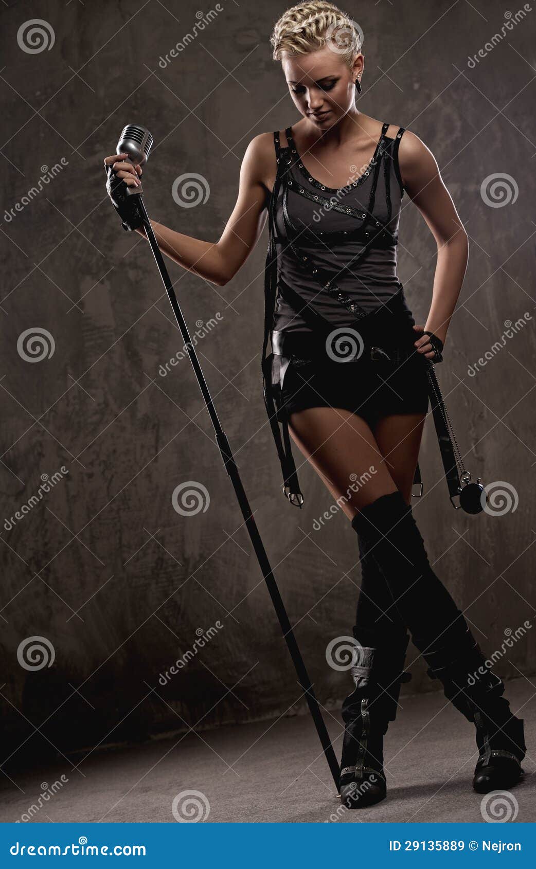 Young Singer with Microphone Stock Image - Image of grey, goth: 29135889