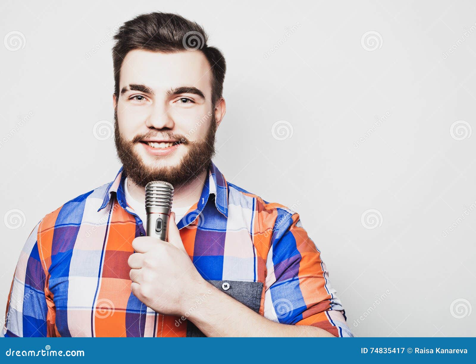 Young Singer with Microphone Stock Image - Image of handsome, music ...