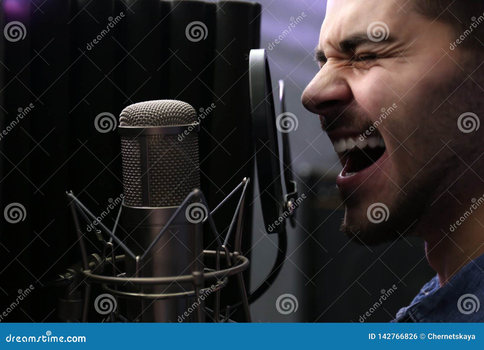 Young Singer with Microphone Recording Song Stock Photo - Image of ...
