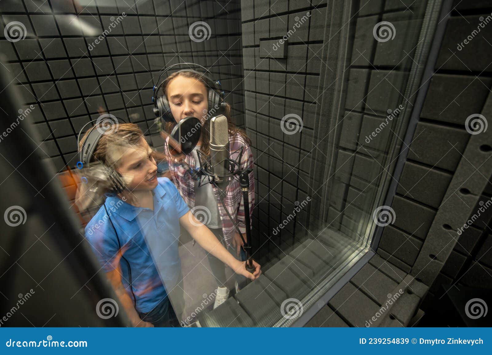Young Singers Singing into the Mike in the Recording Studio Stock Image ...