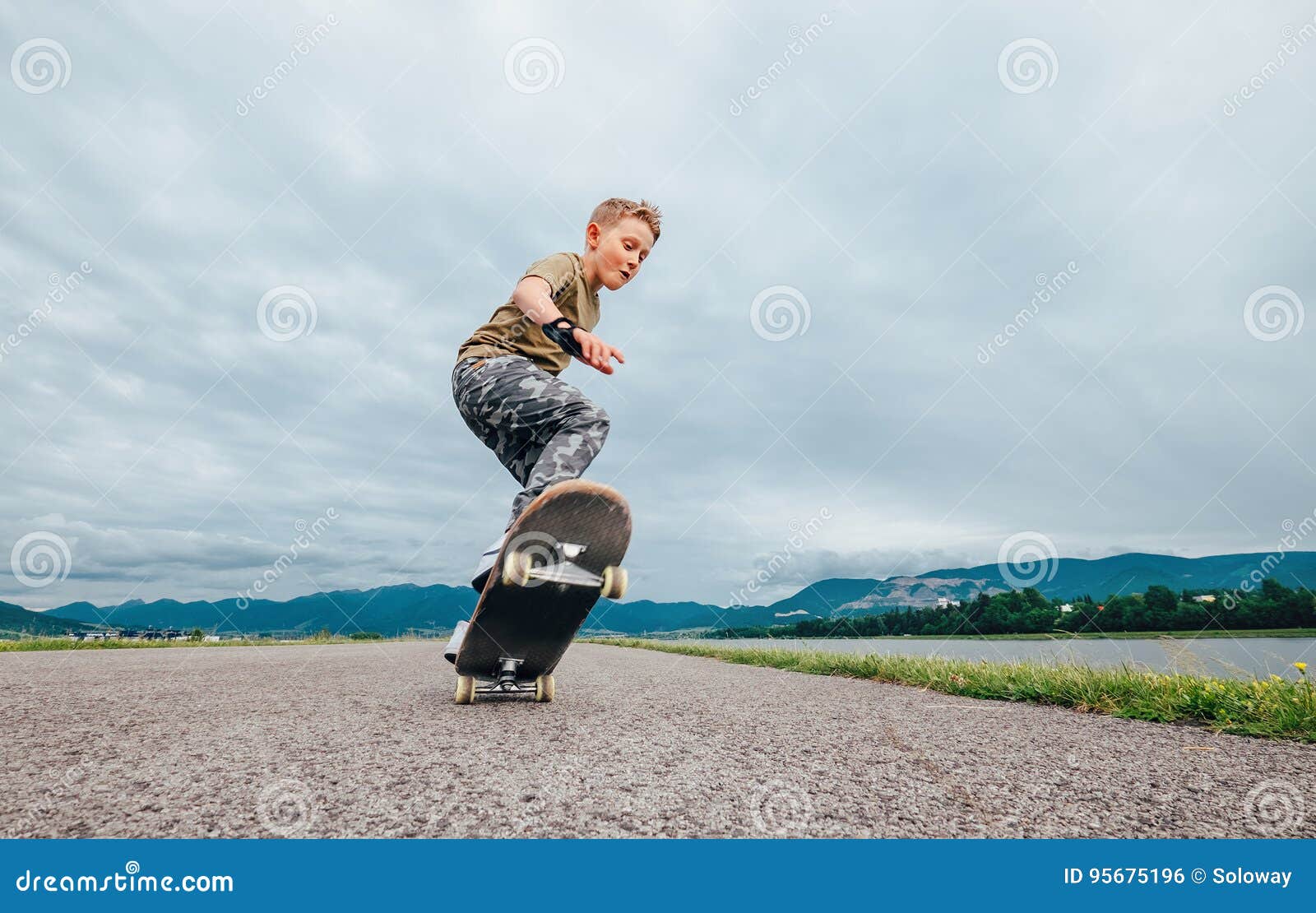 Young Skateboarder Make a Tricks with Skateboard Stock Photo - Image of ...