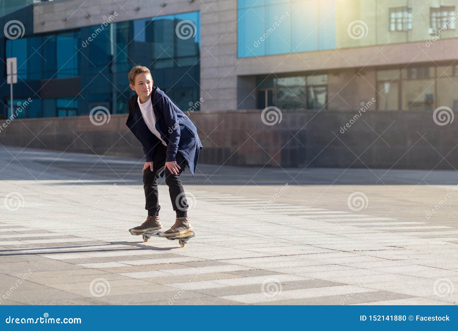 Young Skateboarder on the Street on a Longboard Moving Stock Photo ...
