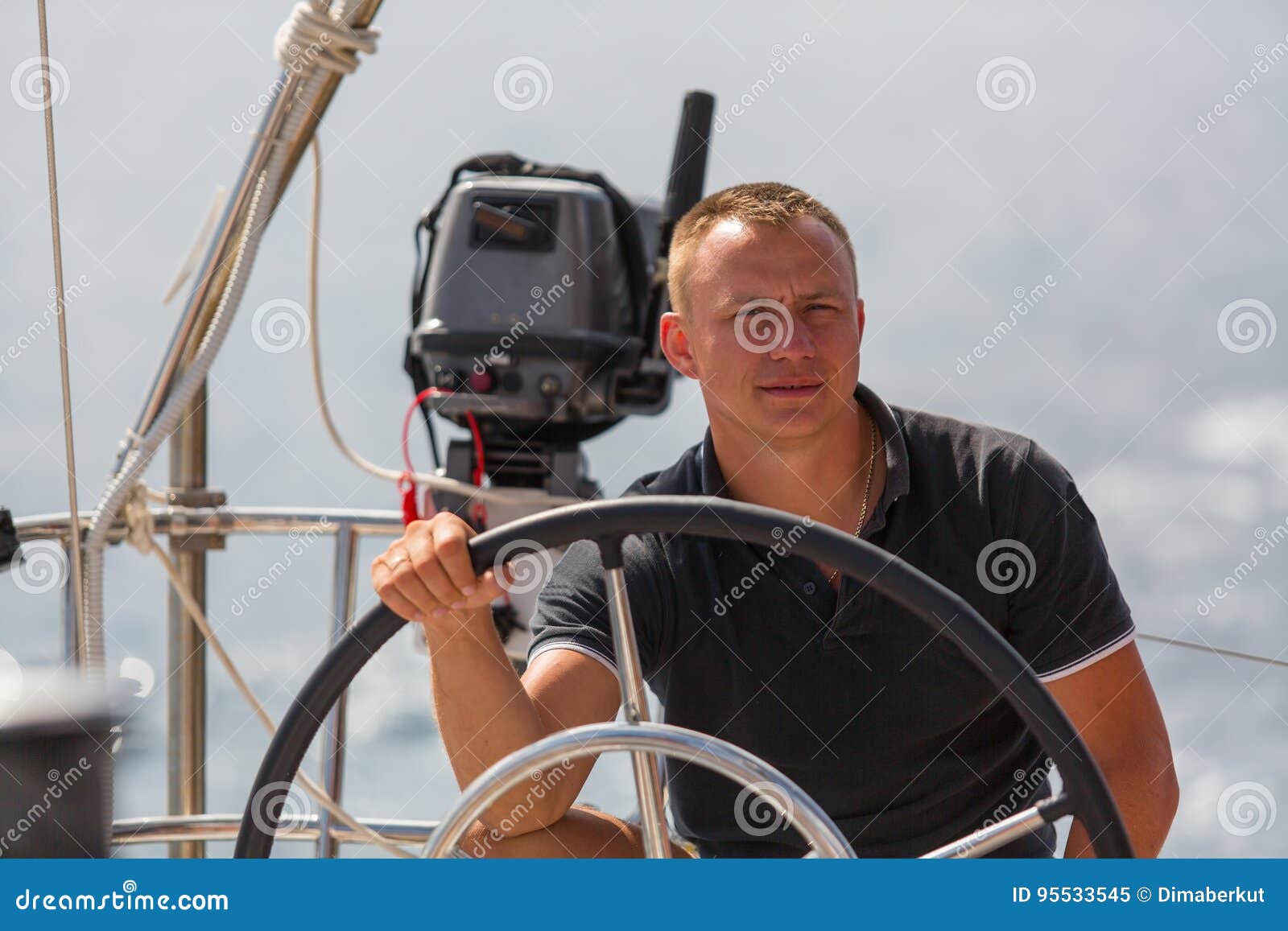 A Young Skipper at the Helm of a Sailing Ship. Sport. Stock Image ...