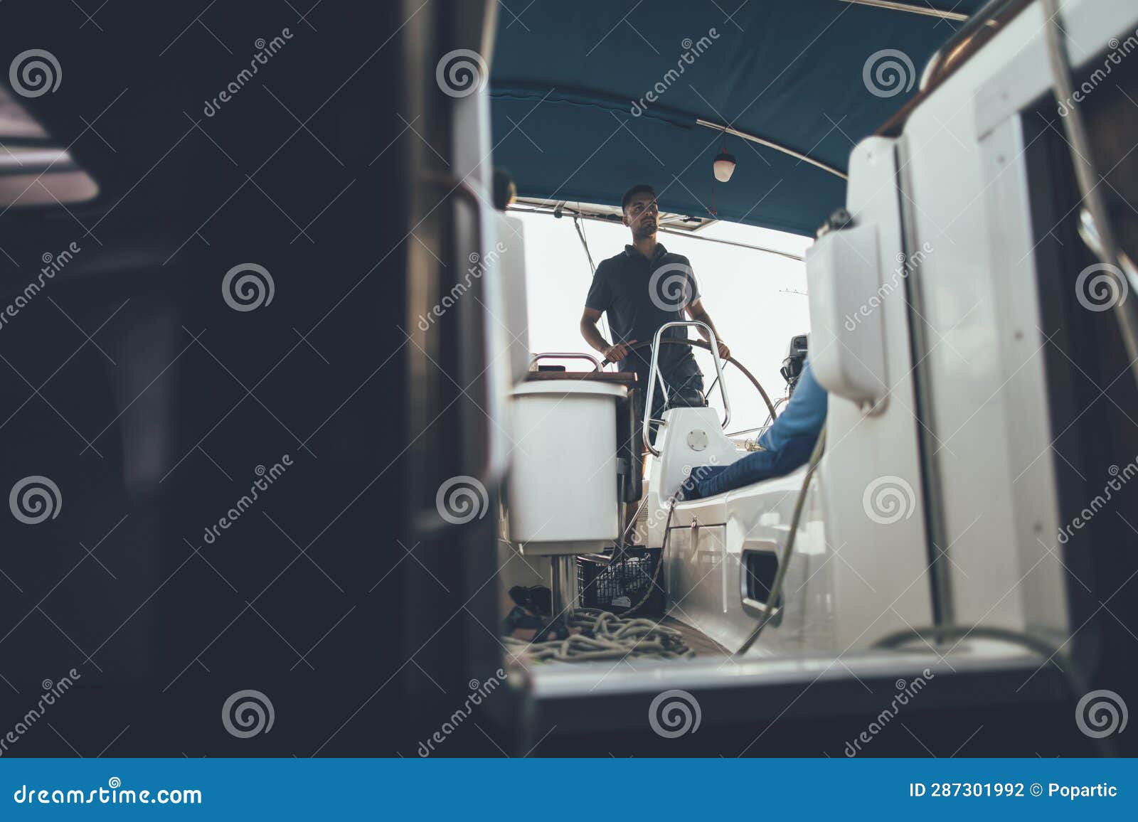 Young Skipper at the Sailboat Helm Position Stock Photo - Image of ...