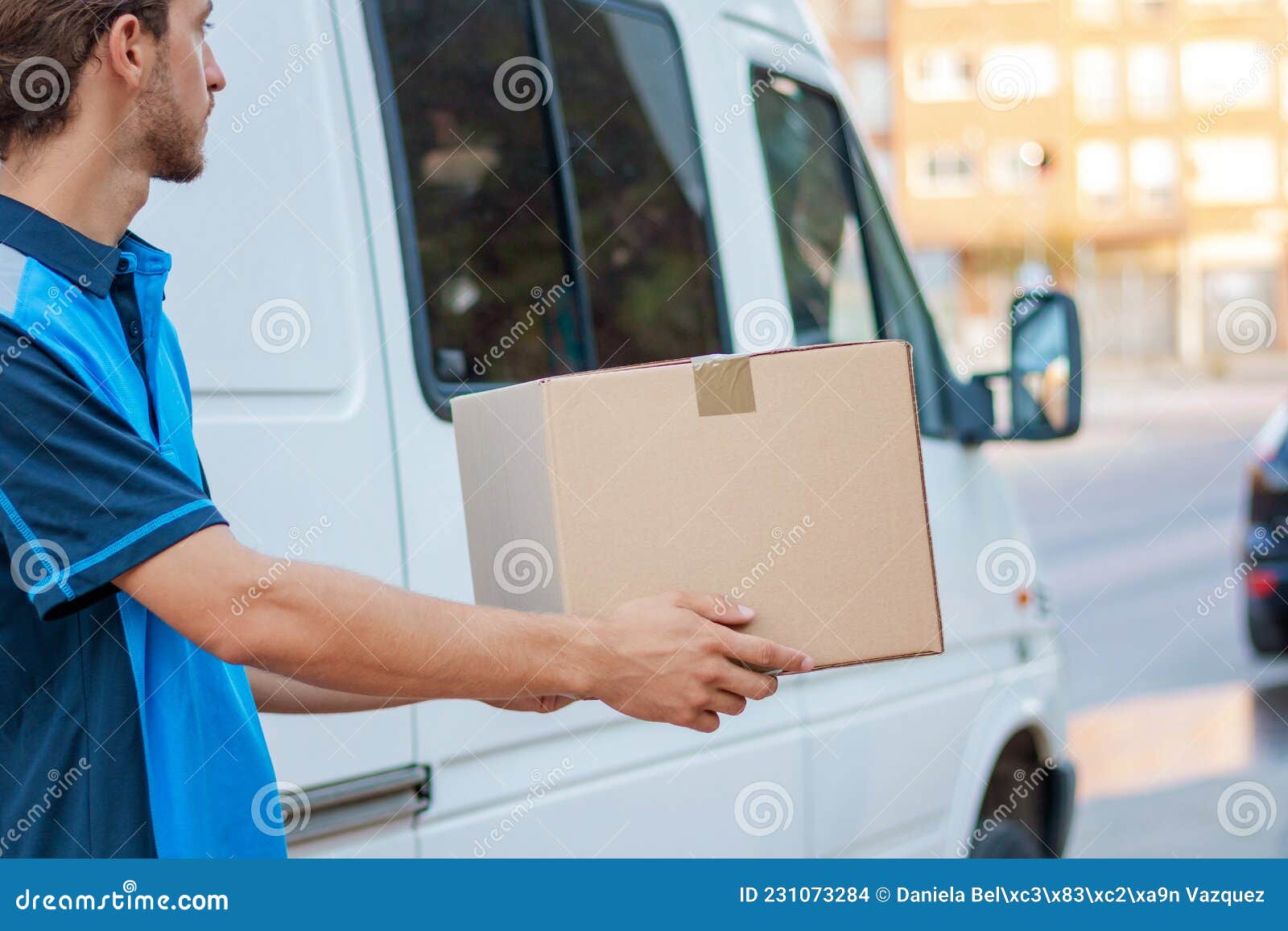 Delivery Boy Using the Phone Stock Photo - Image of phone, fragile ...