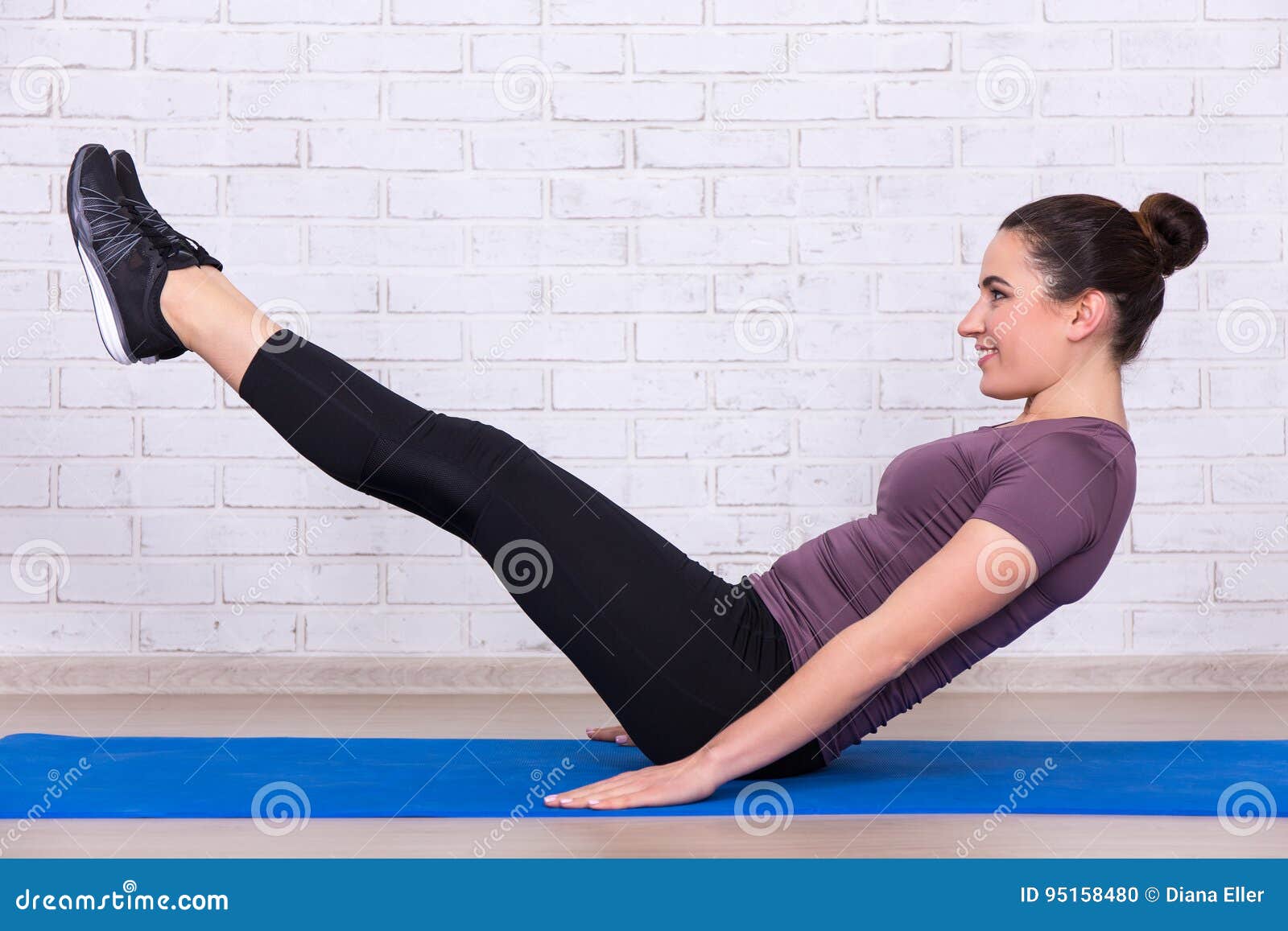 Young Slim Sporty Woman Doing Exercises For Abdominal Muscles Stock
