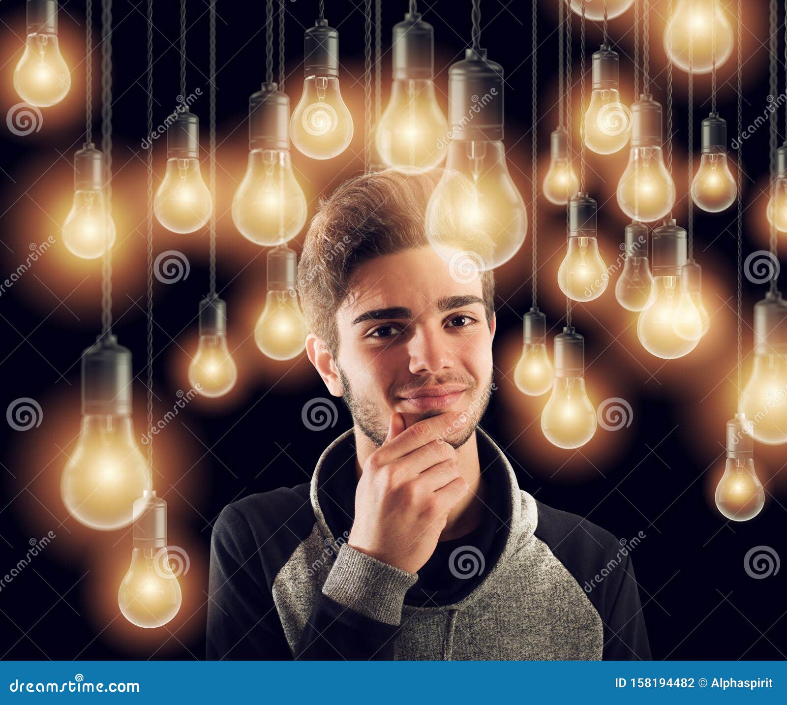 Young Smart Boy Illuminated by Light Bulbs. Concept of Creativity Idea ...