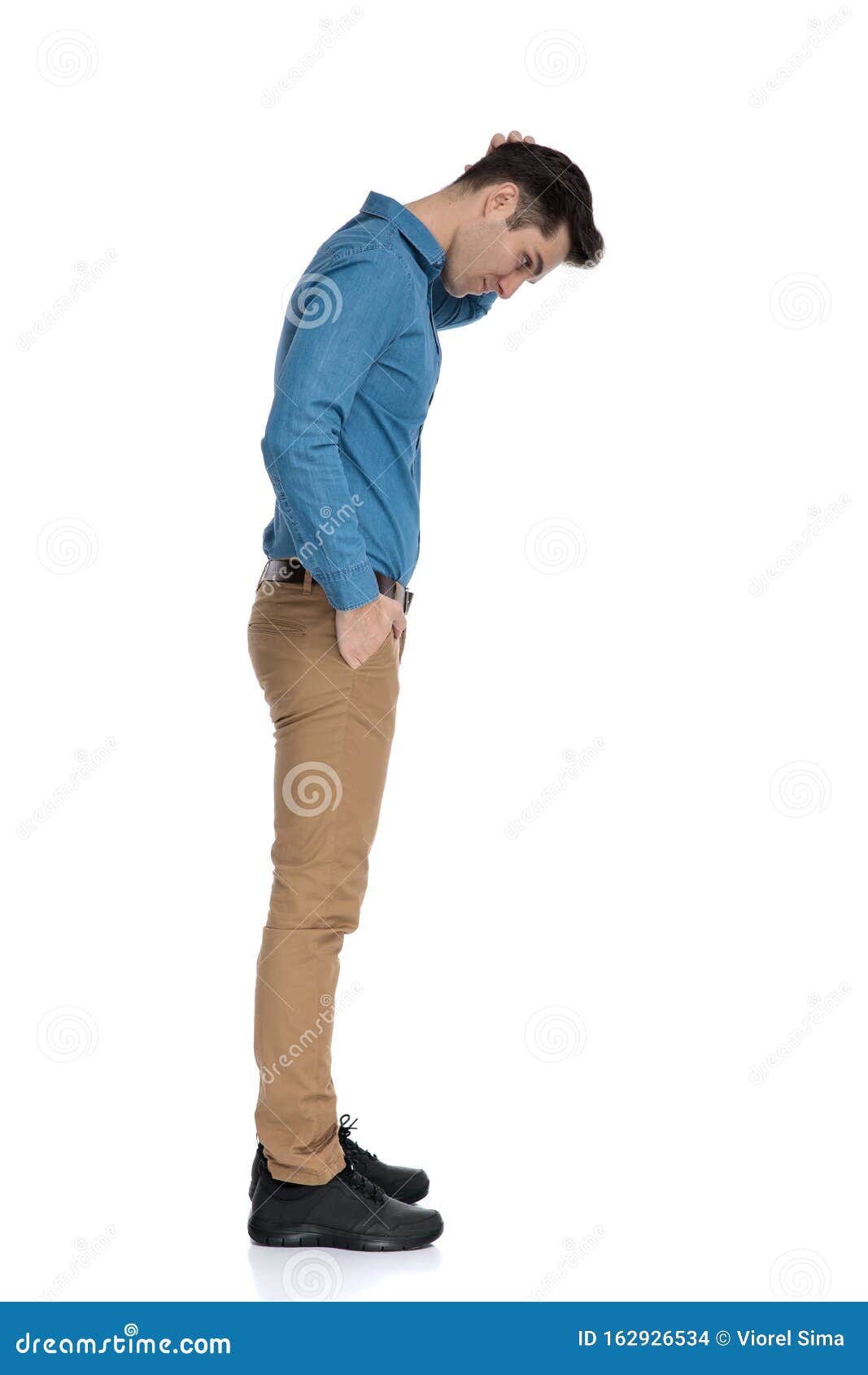 Young Smart Casual Man Looking Down and Scratching Head Stock Photo ... Young Smart Casual Man Looking Down and Scratching Head Stock Photo ...