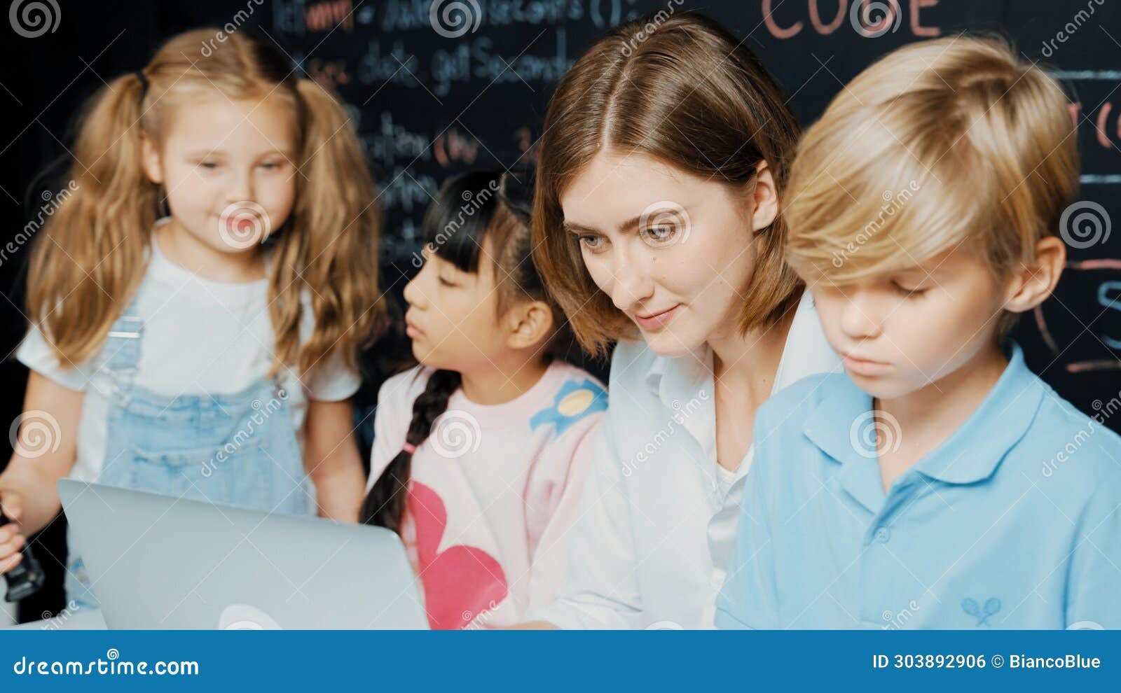 Young Smart Teacher Using Laptop To Teach Student Programing System ...