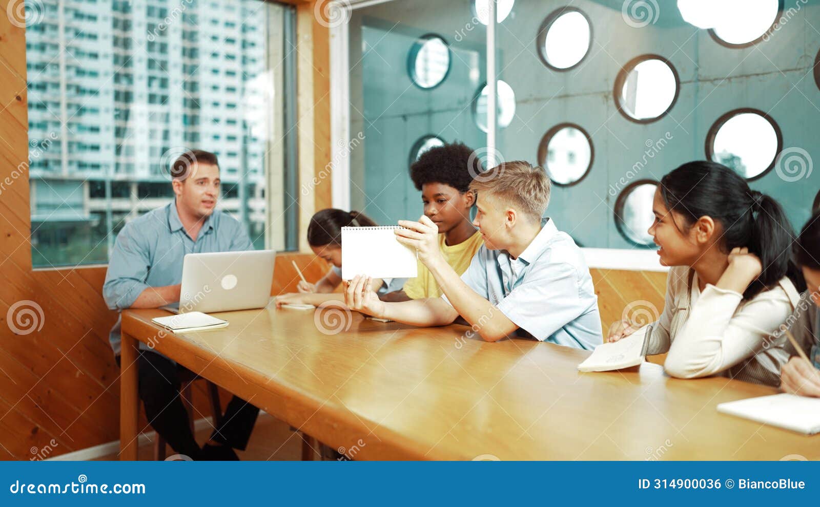 Young Smart Teenager Writing and Talking about Topic at Classroom ...