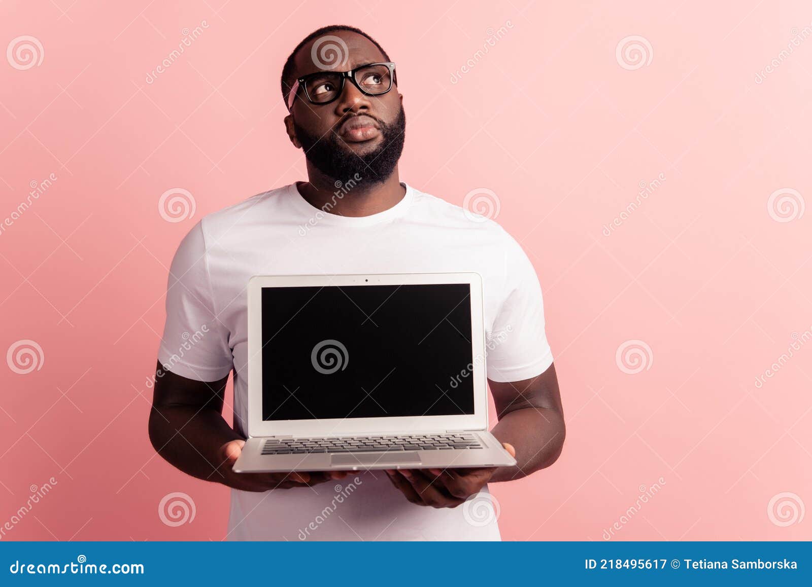 Young Smiling African Man Standing and Using Laptop Computer Show ...