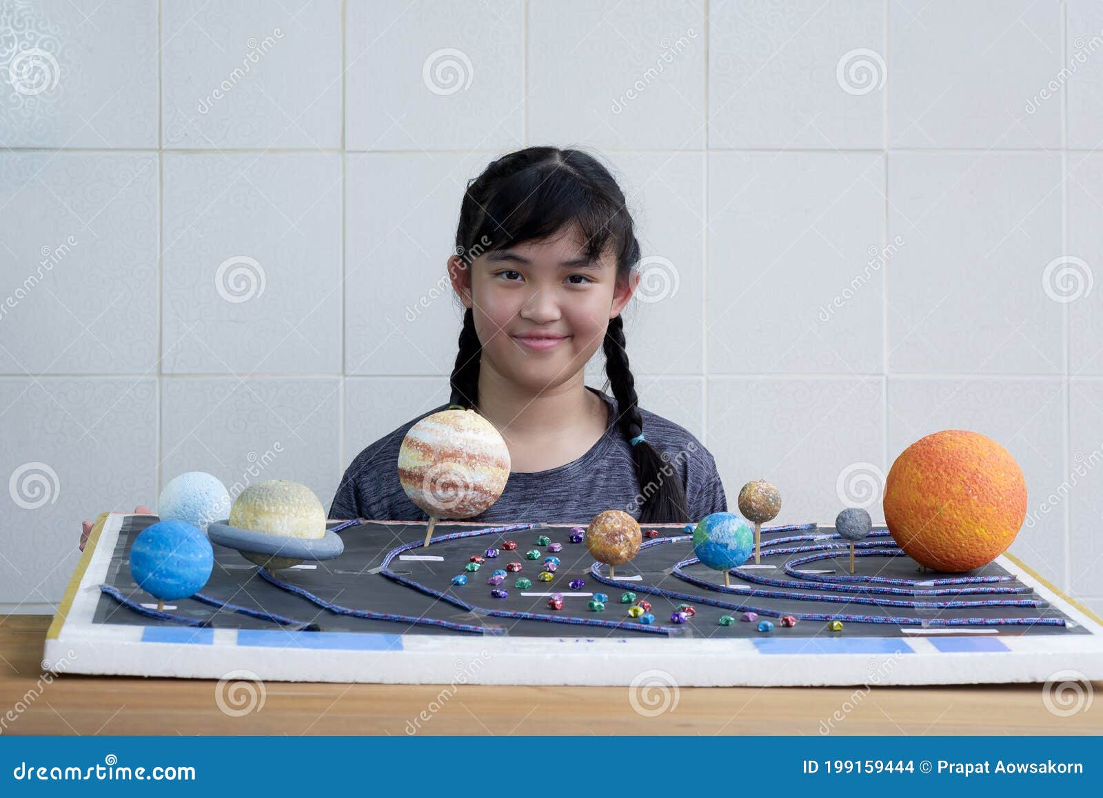 Asian Girl Showing Her Homemade Solar System Model for Science Homework ... Asian Girl Showing Her Homemade Solar System Model for Science Homework ...