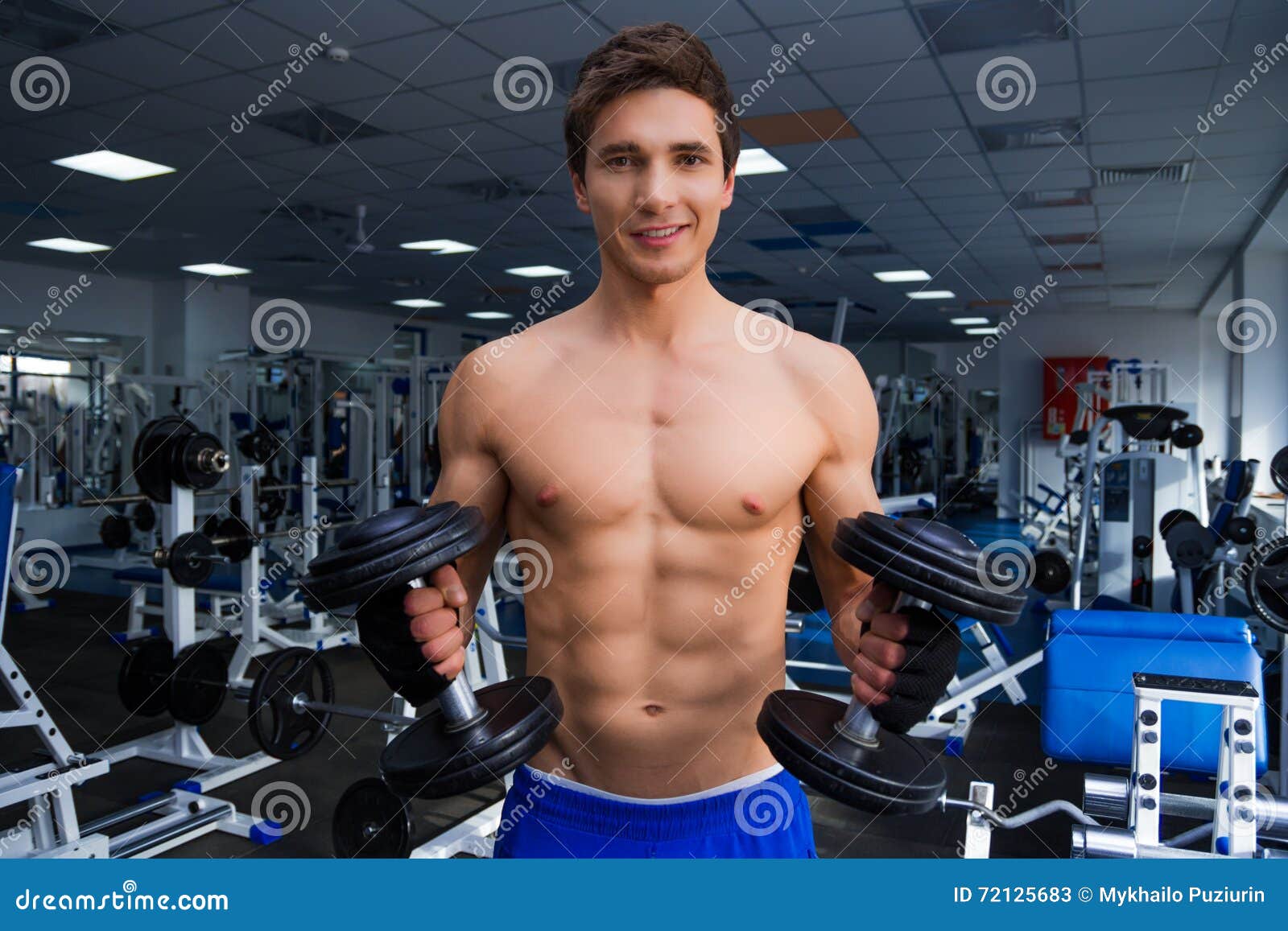 Young Smiling Athlete Lifting Weights in the Gym Stock Image - Image of ...