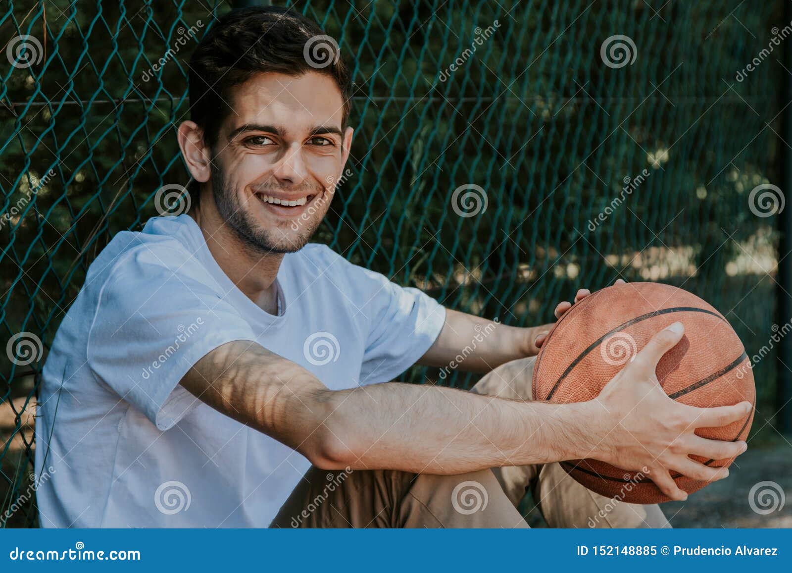 Young Smiling with Basketball Stock Image - Image of expressions ...