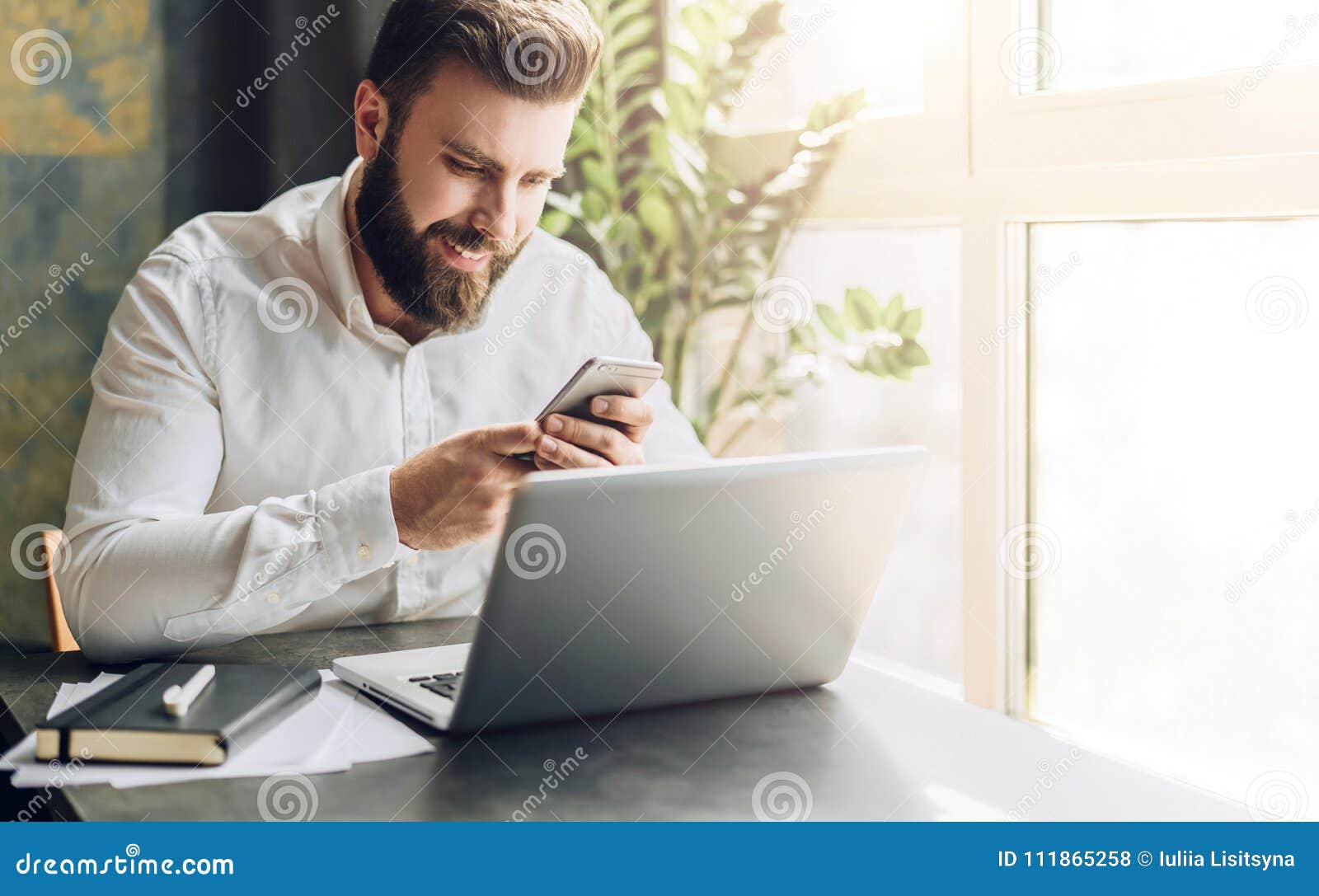 Young Smiling Bearded Businessman Sitting at Table in Front of Computer ...