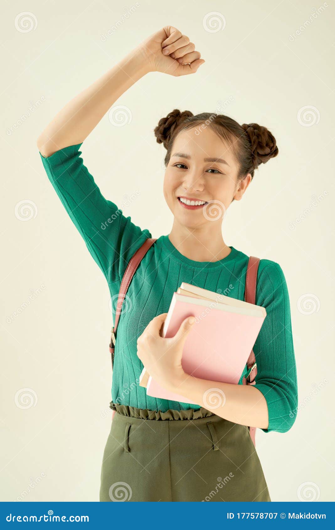 Young Smiling Beautiful Woman with Hands Up, Pleased with the Success ... Young Smiling Beautiful Woman with Hands Up, Pleased with the Success ...