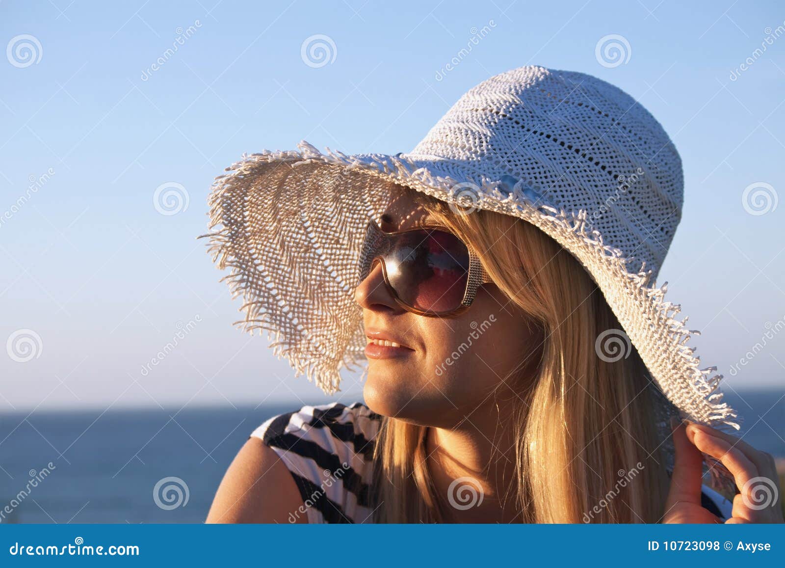 Young Smiling Blond Woman Looking at Sunset Stock Photo - Image of dusk ...