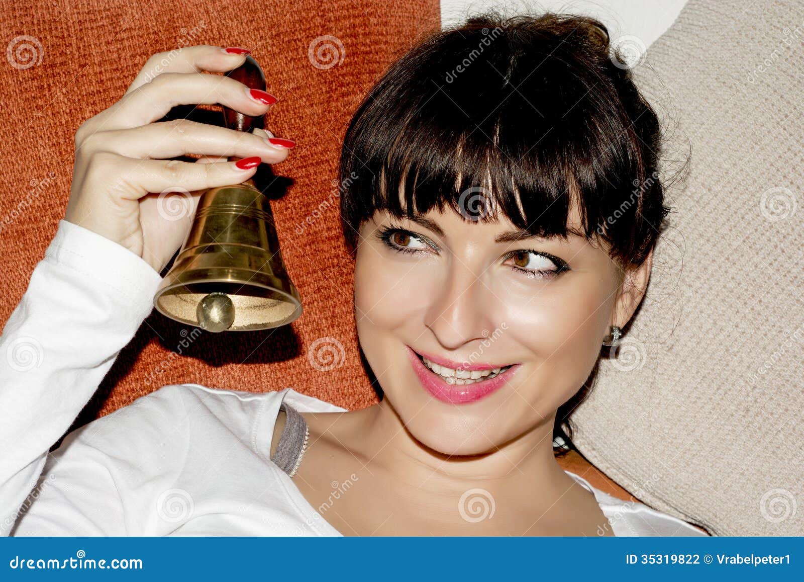 Young Smiling Brunette Ringing Christmas Hand Bell Stock Photo - Image ...