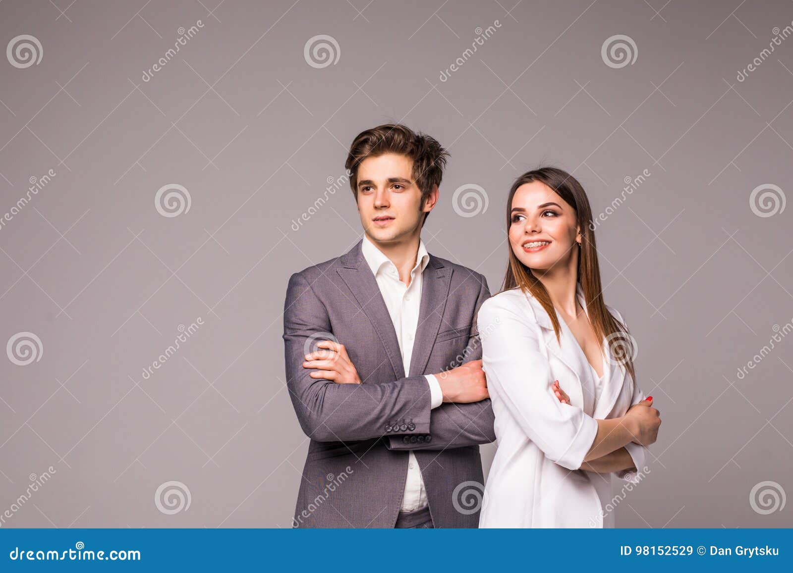 Young Smiling Business Woman and Business Man Isolated on Gray ... Young Smiling Business Woman and Business Man Isolated on Gray ...