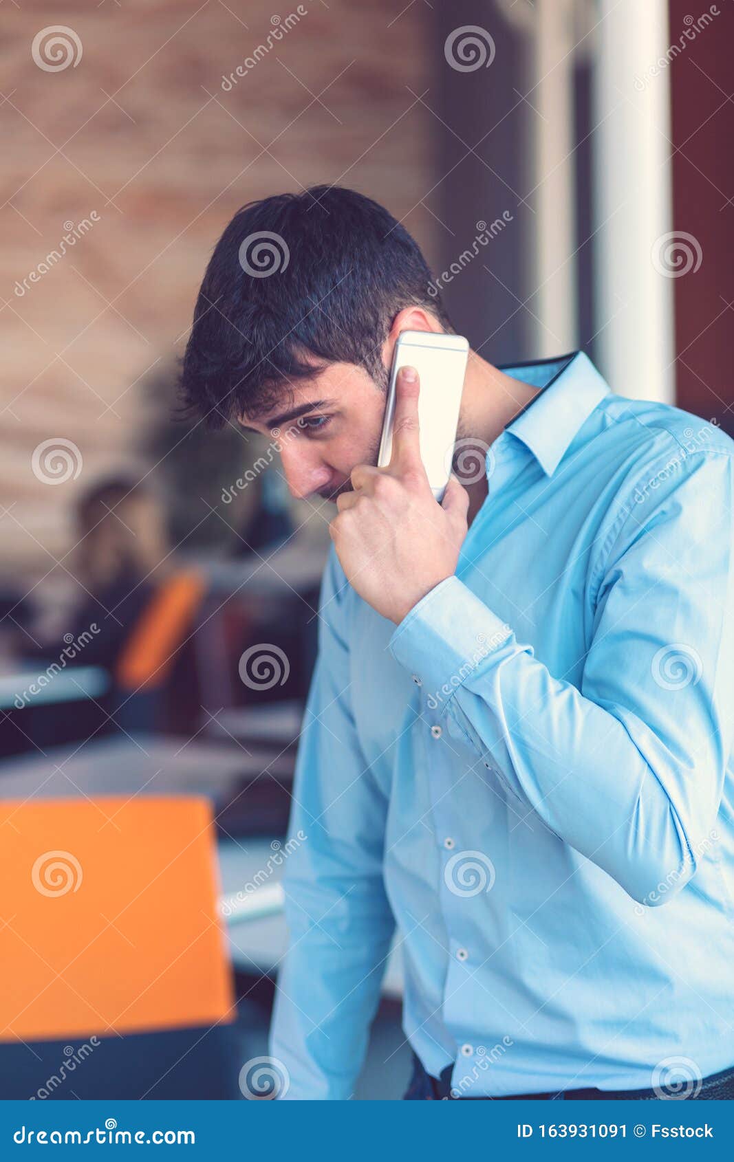 Young Smiling Businessman Calling on Phone at Office. Stock Image ...