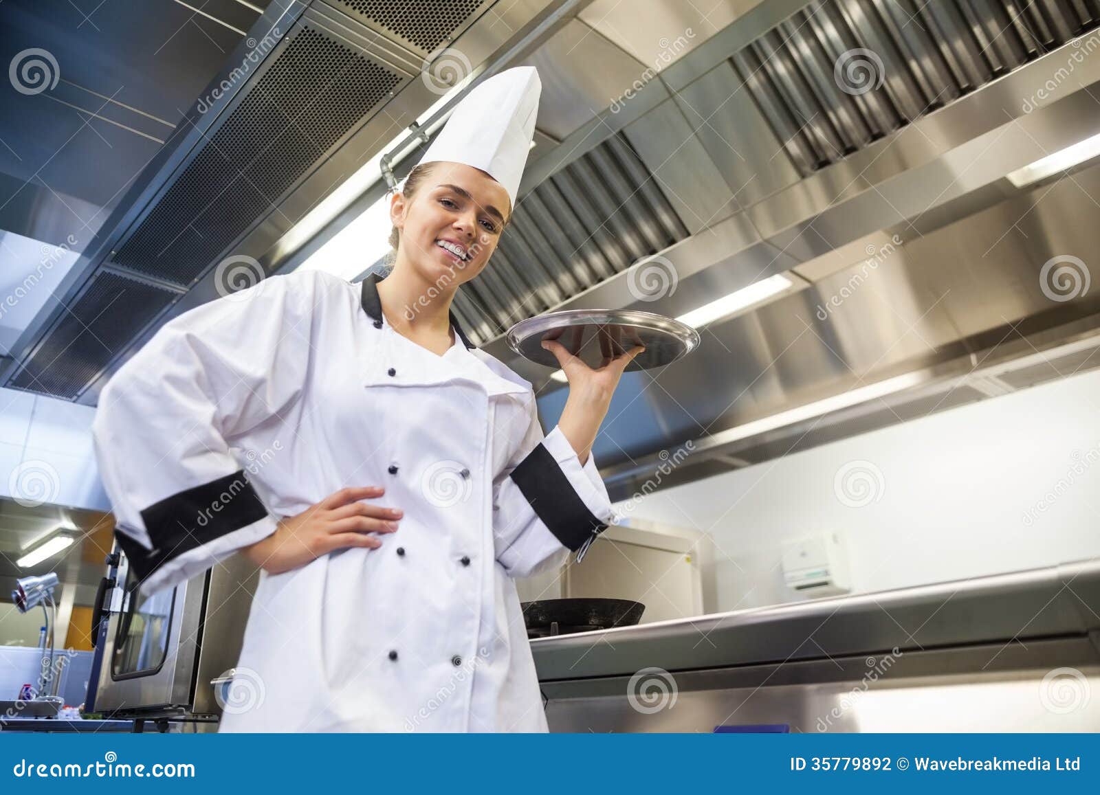 Young Smiling Chef Holding Tray Stock Photo - Image of professional ...