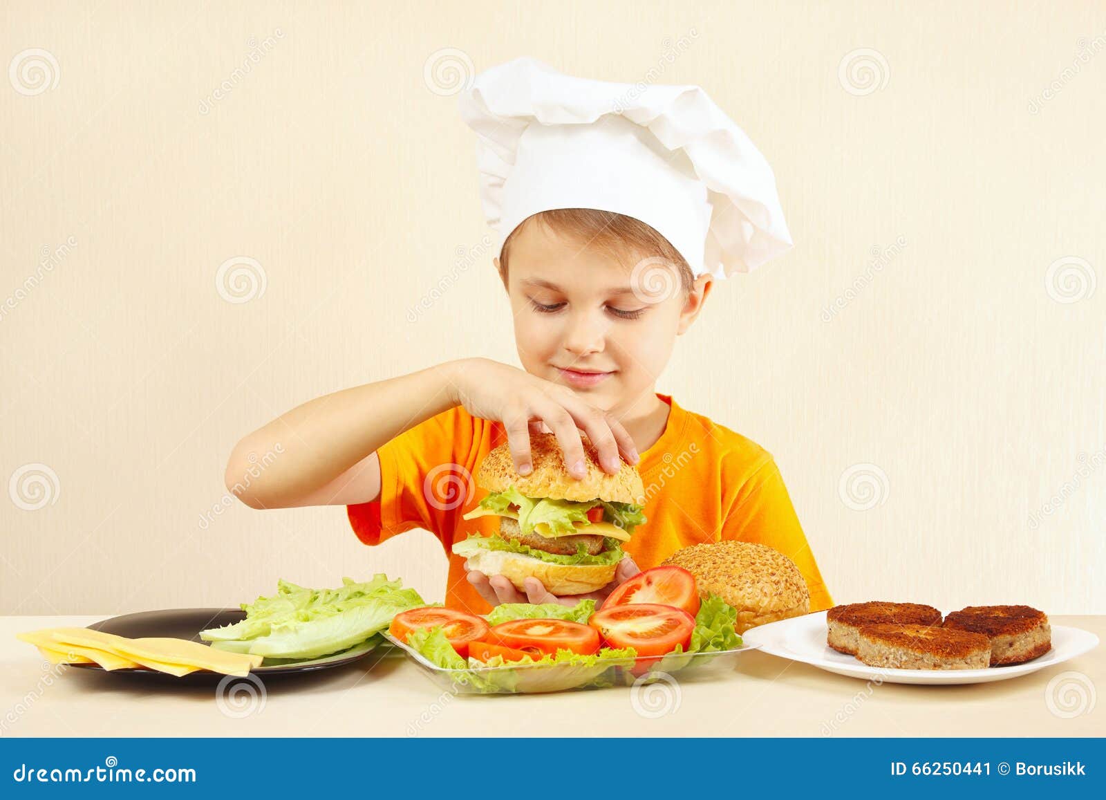 Young Smiling Chef Shows How To Cook Hamburger Stock Image - Image of ...