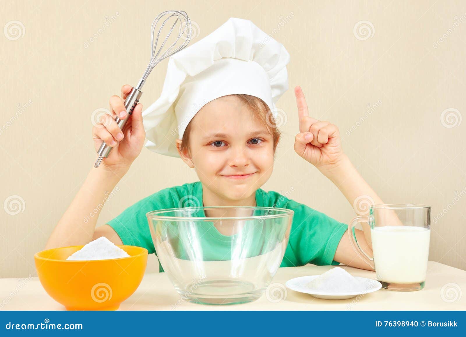 Young Smiling Chef at the Table with Ingredients is Going To Cook Cake ...