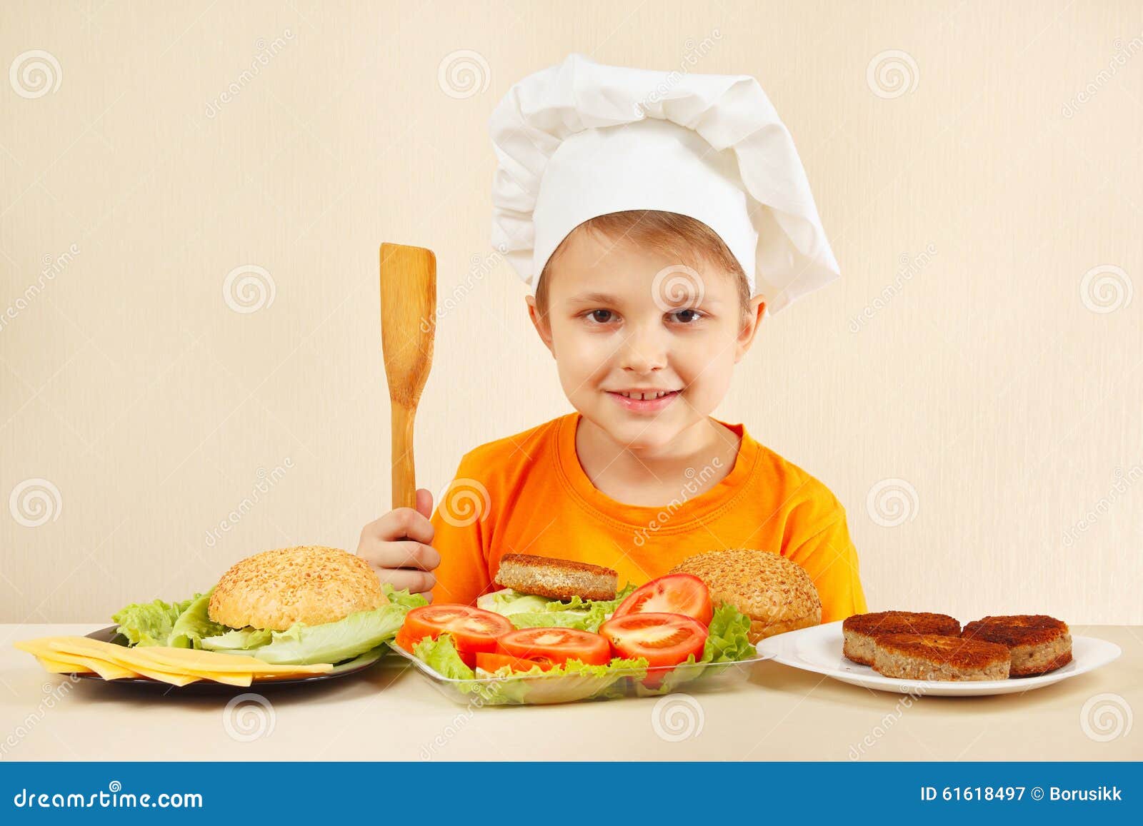 Young Smiling Chef at the Table with Ingredients is Going To Cook ...