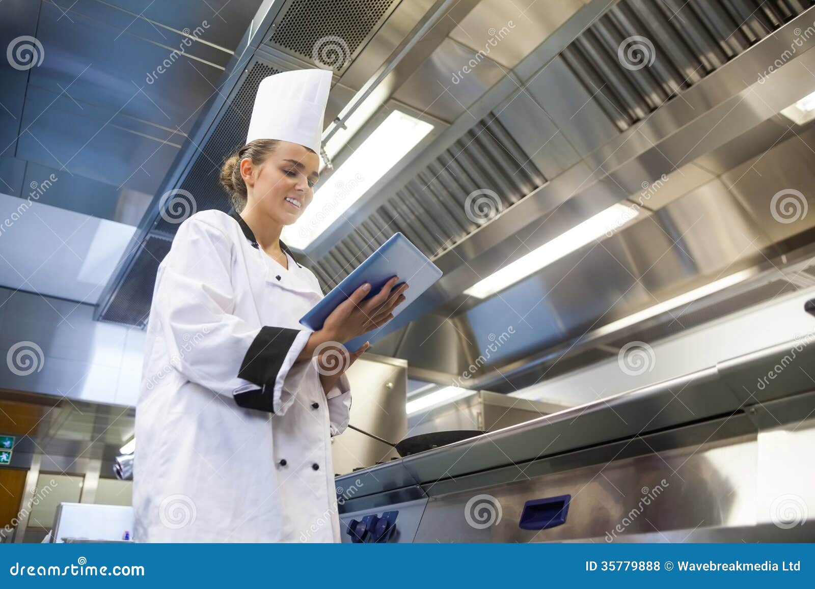 Young Smiling Chef Using Tablet Stock Photo - Image of commercial ...