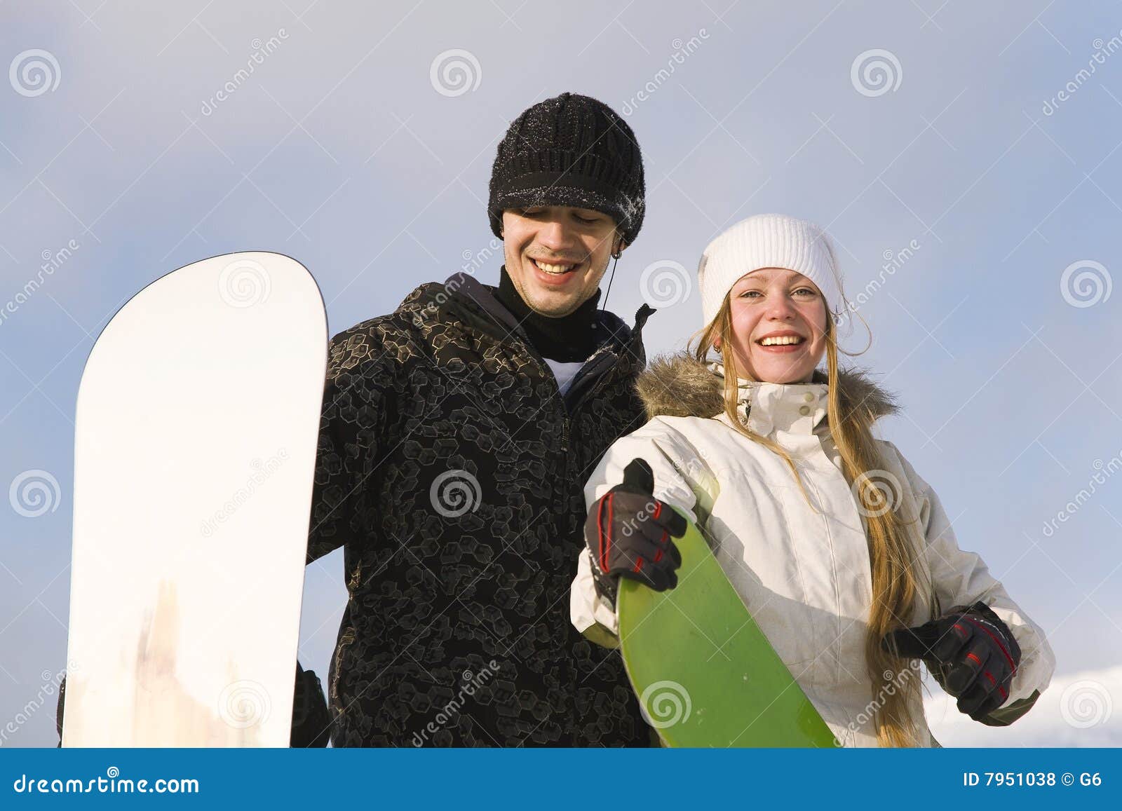 Young Smiling Couple with Snowboards Stock Photo - Image of resorts ...