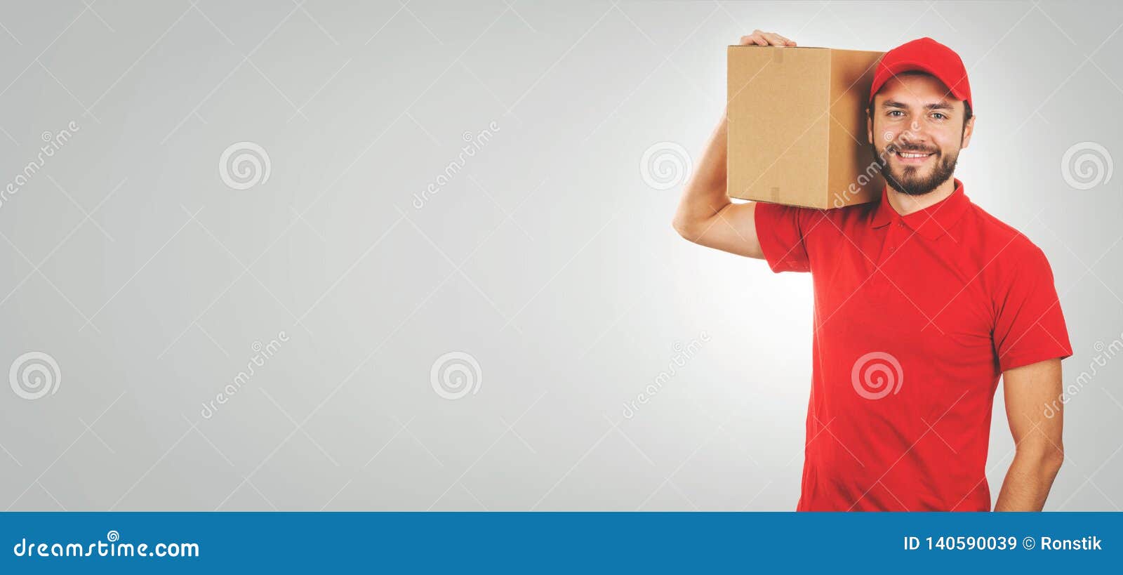 Young Smiling Delivery Man in Red Uniform and with Shipment Box on ...