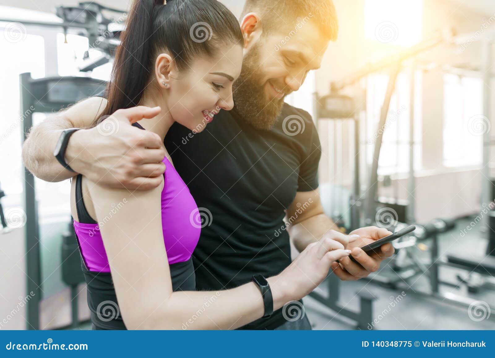 Young Smiling Fitness Couple Talking In The Gym Sport Training