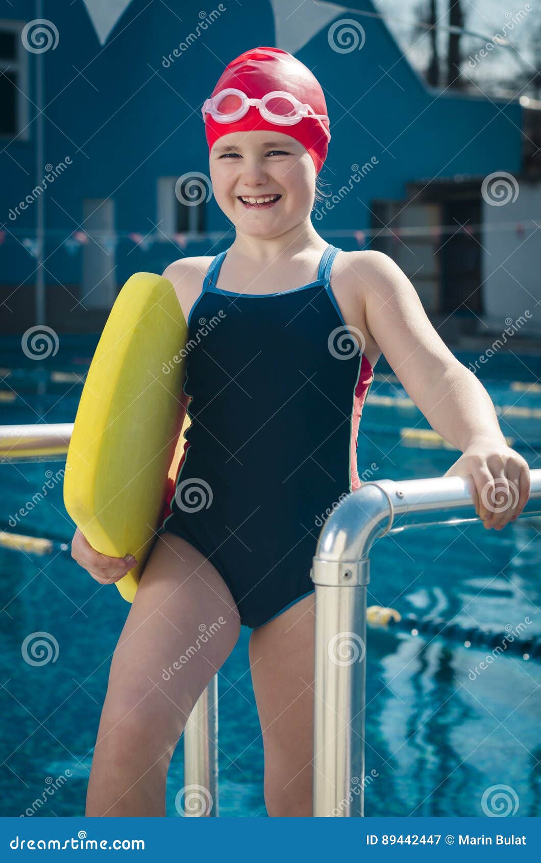 Young Smiling Girl Learning To Swim in the Pool Stock Image - Image of ...