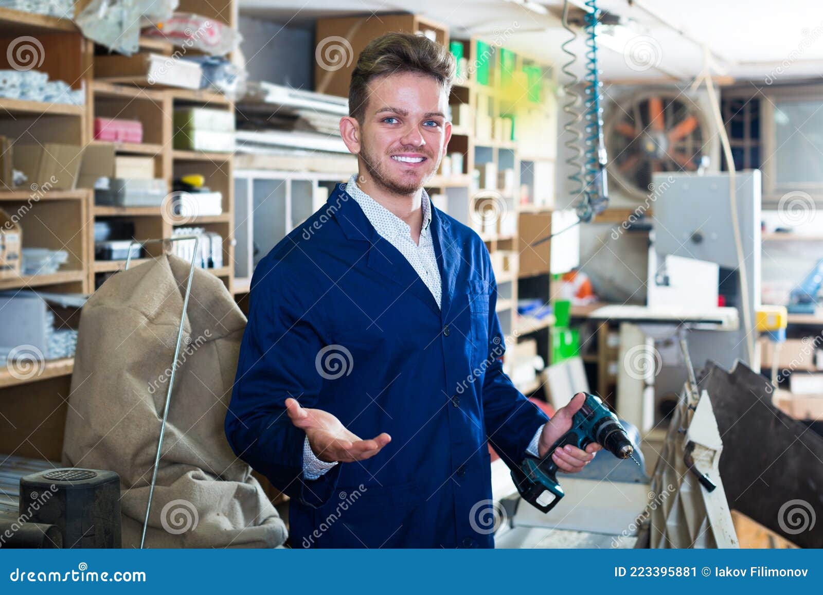 Young Smiling Guy Working with Professional Drill Stock Image - Image ...