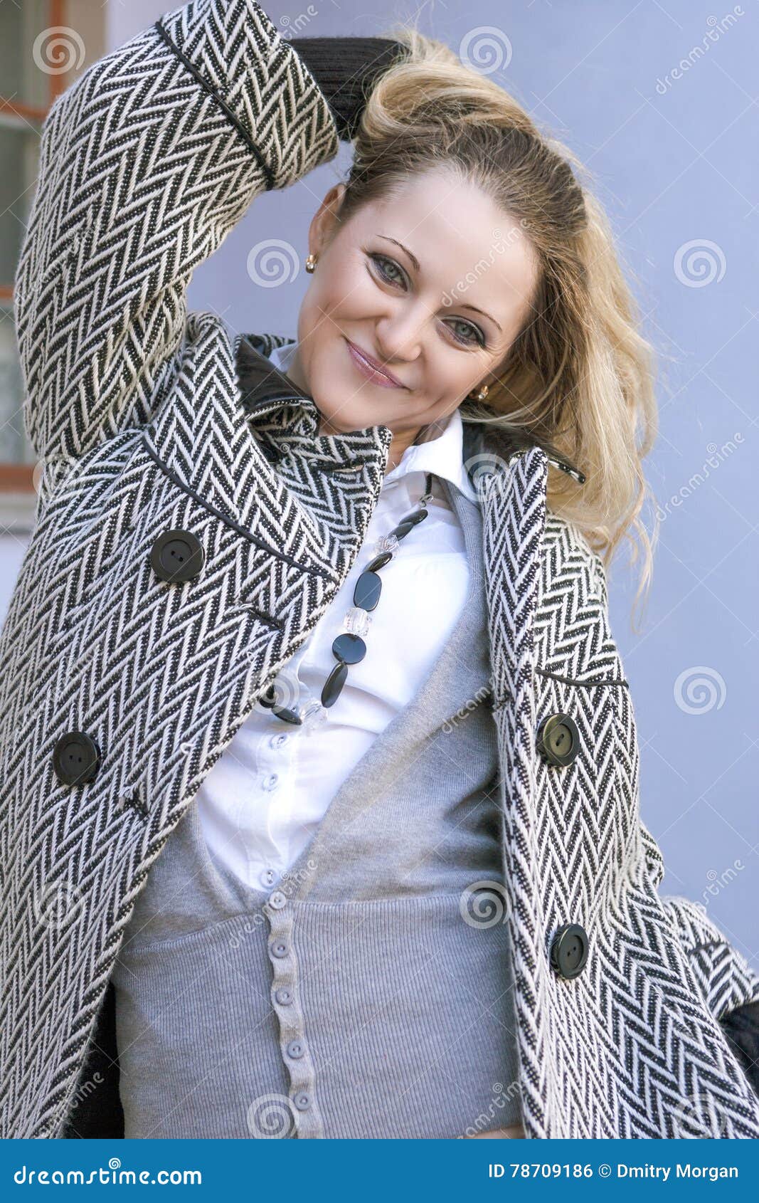 Young Smiling Happy Caucasian Blond Woman Posing Outdoors In City
