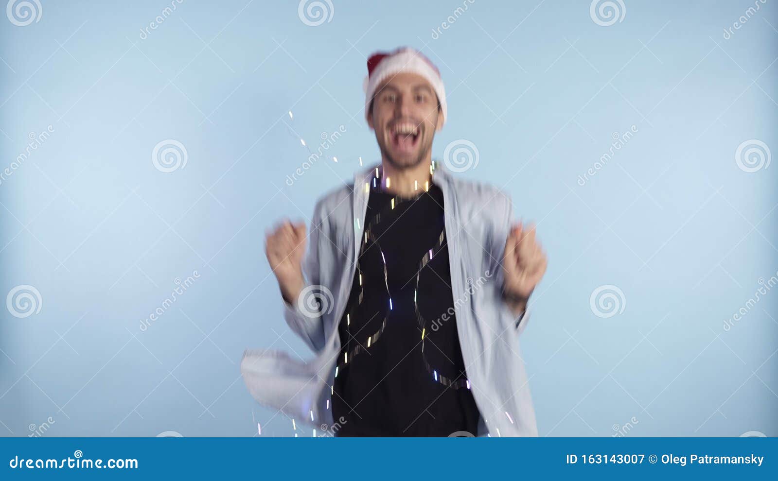 Young, Smiling Man in Casual Clothes and Santa Hat on a Head Exploding ...