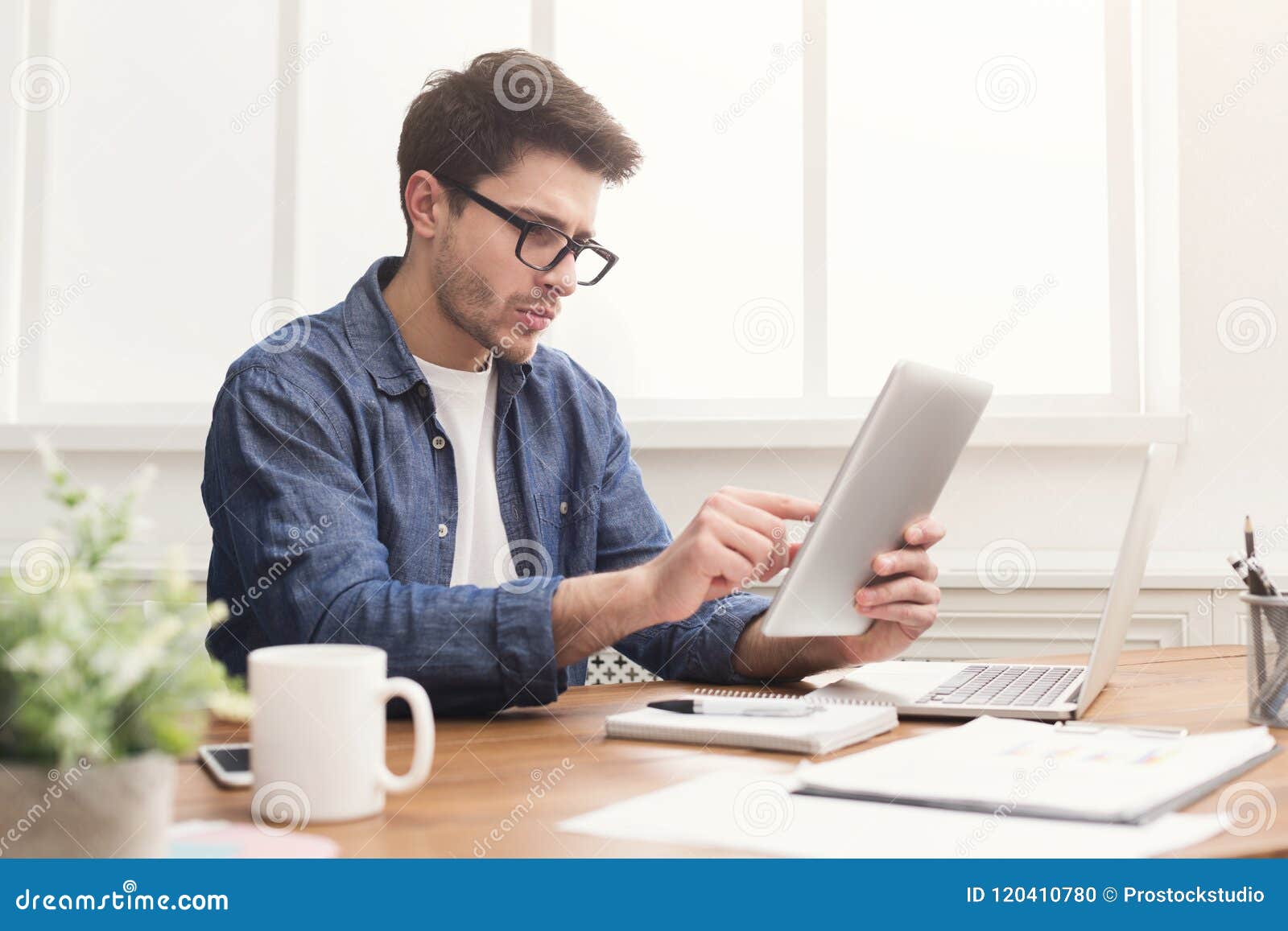 Young Businessman Working with Digital Tablet in Office Stock Photo ...