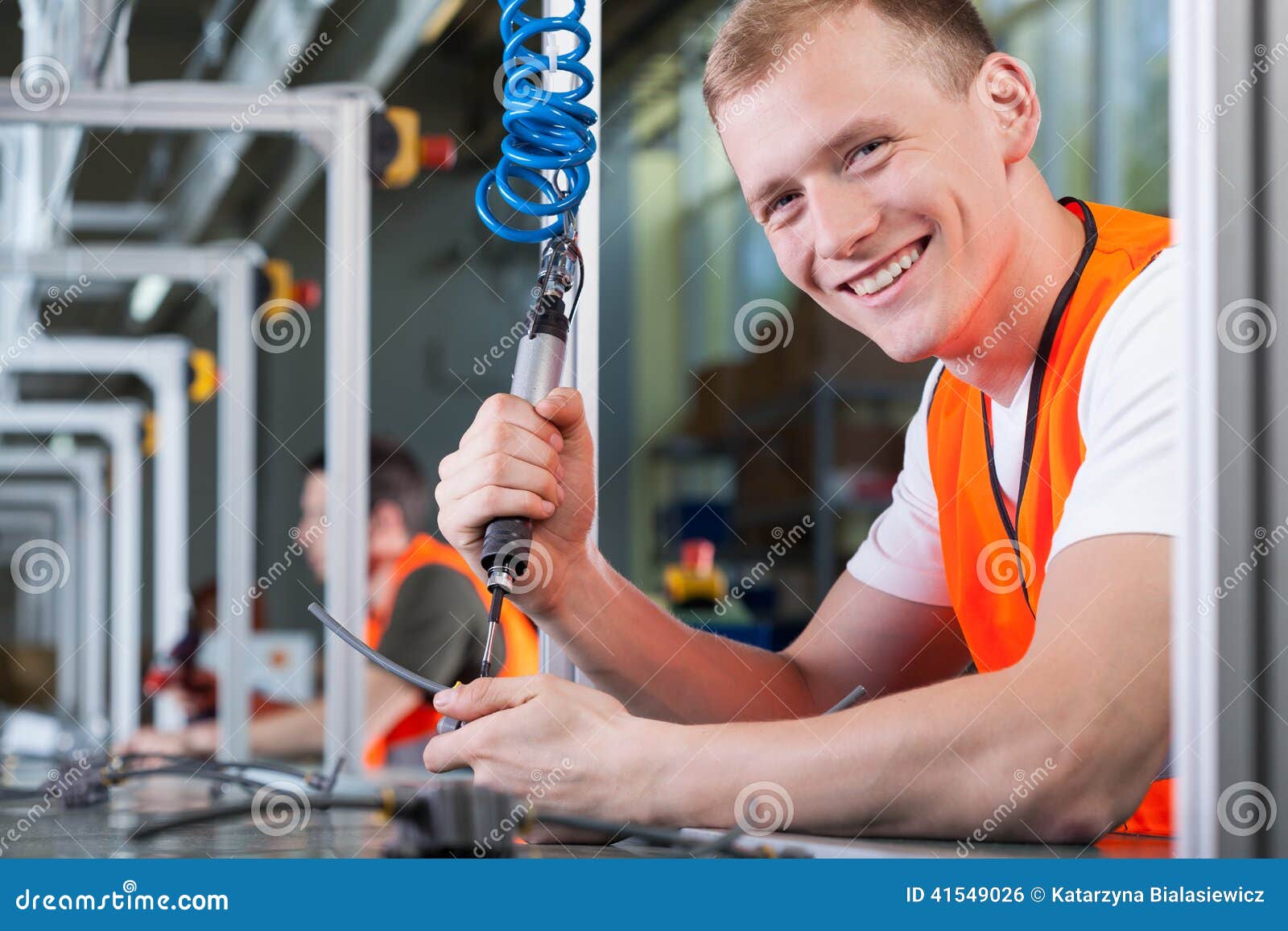 Young Smiling Man Working on the Production Line Stock Photo - Image of ...