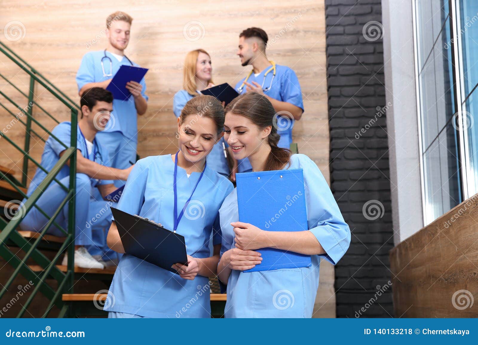 Young Smiling Medical Students in Hall Stock Photo - Image of ...