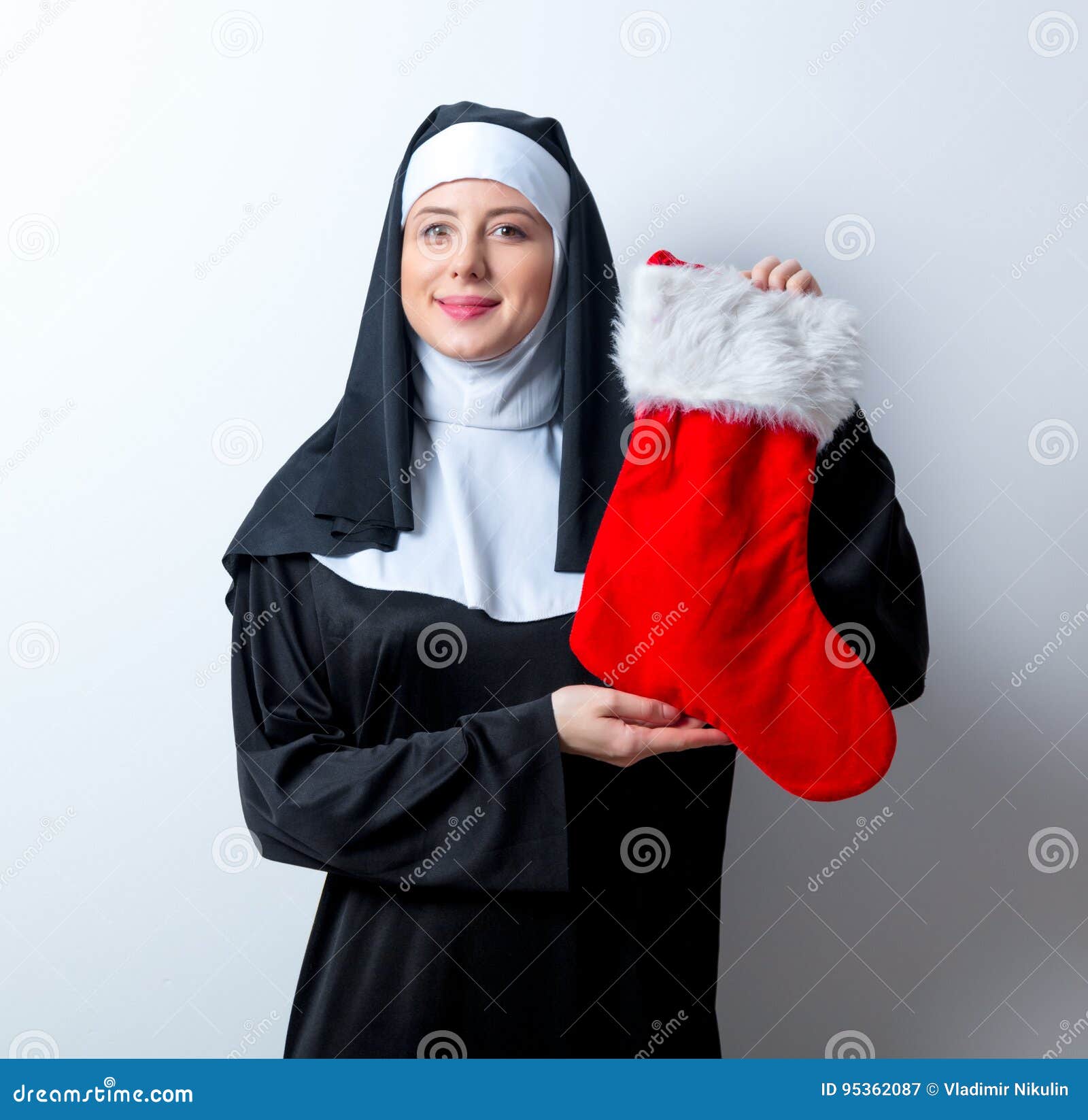 Young Smiling Nun with Christmas Sock Stock Image - Image of ancient ...