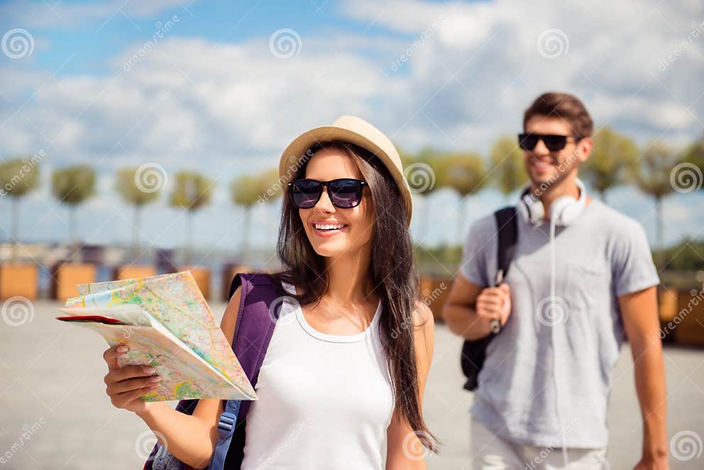Young Smiling People Searching for Direction Using Paper Map Stock ...