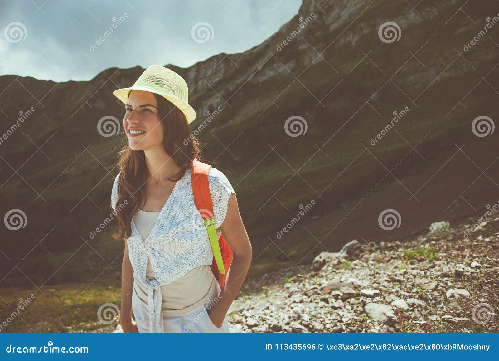 Young Smiling Woman with Backpack Walking and Travelling Along Mountain ...